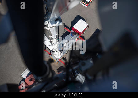 Mechanics maintaining fire engine Stock Photo - Alamy