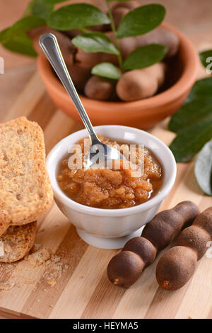 tamarind jam in white bowl with fruits around Stock Photo - Alamy