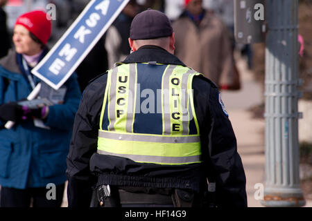 An armed United States Capitol police officer stands guard on the House ...