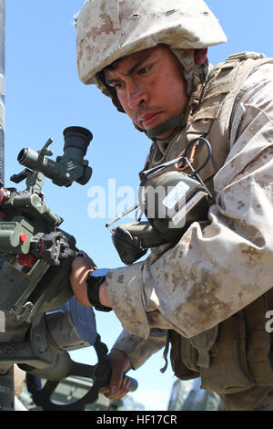 A Marine gunner with Echo Battery, 2nd Battalion, 10th Marine Regiment ...
