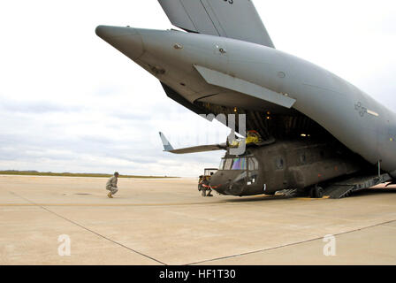 An Illinois Army National Guard CH-47 Chinook exits an Air Force C-17 ...