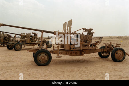 An Iraqi S-60 57mm automatic anti-aircraft gun sits in its emplacement ...