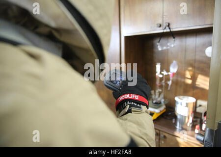 SWAT team members armed with service rifles, standing in stack ...