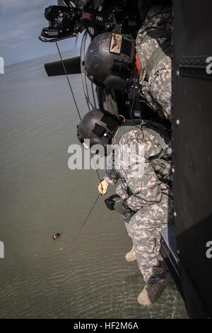 Sgt. A.J. Harrelson (sitting) and Sgt. Chris Renaud hoist Lynn ...