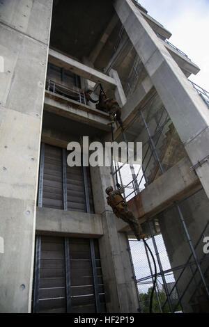 Marines practice their fast-roping skills Dec. 3 at the Camp Hansen ...