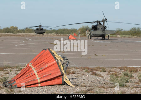 A Bambi Bucket used in aerial firefighting lays on a landing strip ...