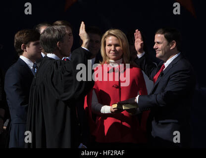 Arizona Gov. Doug Ducey and his wife Angela Ducey, follow the casket of ...