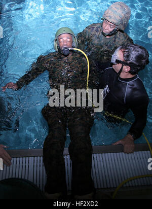 An underwater egress training instructor prepares Marines from the 31st ...