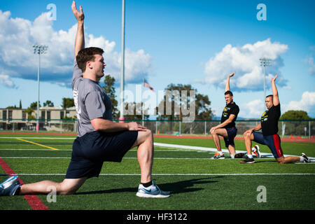 Track and field athletes warm-up exercise Stock Photo: 92330281 - Alamy