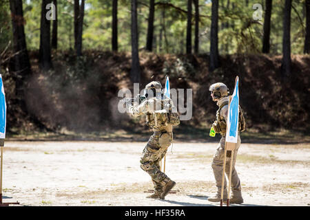 A Deployable Specialized Forces U.S. Coastguardsman fires an Mk18 rifle ...