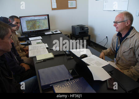 Tom Billson, the Chief Pilot for Bode Aviations, prepares for flight at ...