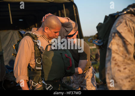 Marine parachute riggers with 2nd Radio Battalion prepare to execute a ...