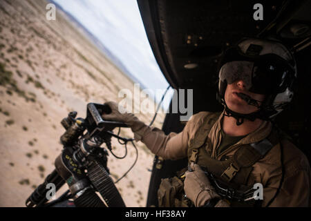 A Marine crew chief from HMLA-269 inspects a UH-1 Huey at Marine Corps ...