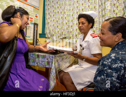 Cmdr. Protegenie Reed (right) a Navy midwife, from Miami, Fla., and ...