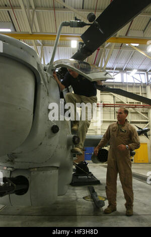 An AH-1Z Viper and UH-1Y Venom helicopters with Marine Light Attack ...