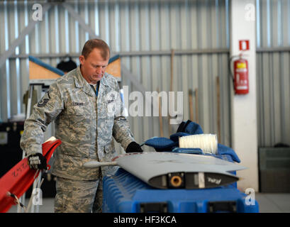 LIELVARDE AIR BASE, Latvia-- Master Sgt. Steven Haven aims a radio ...