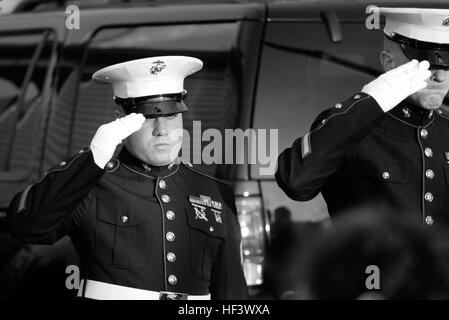 Marines salute as the casket of a field artillery cannoneer from 3rd ...