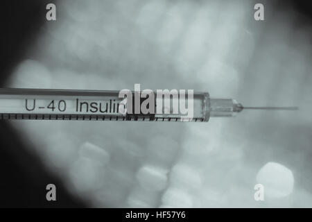 Insulin syringe on multicolored background out of focus Stock Photo - Alamy
