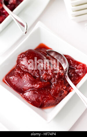 Strawberry jam in white ceramic bowl, isolated on white background. Red ...