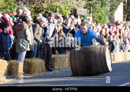 Competitors trying to control their barrel in the annual Boxing Day ...