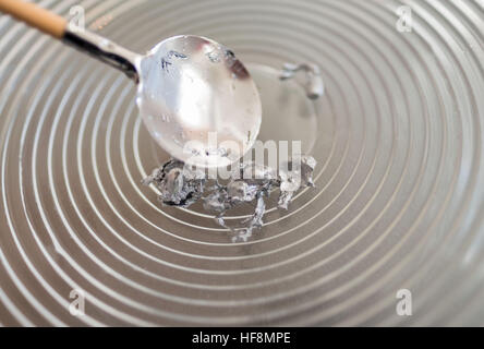 Pouring molten lead on New Year's Eve Stock Photo - Alamy