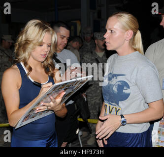 NFL Commissioner Roger Goodell signs autographs for fans on their signs ...