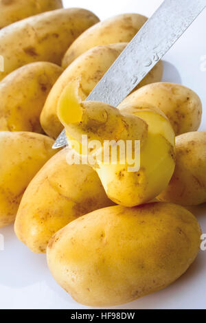 Half peeled potatoes Stock Photo - Alamy
