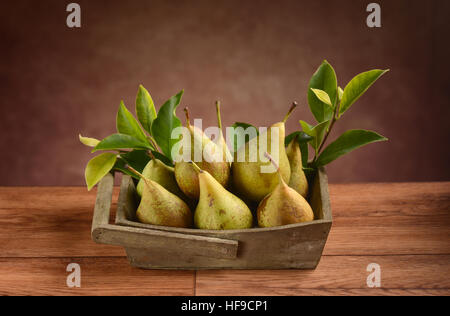 Juicy pears in wooden box isolated on white Stock Photo - Alamy