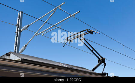 An asymmetrical pantograph connecting the train to the overhead ...
