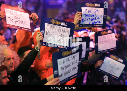 Darts fans holding William Hill 180 cards during day eleven of the ...