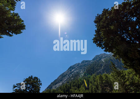 Samaria Gorge. Crete. Greece. Lens flare on the blue sky Stock Photo ...