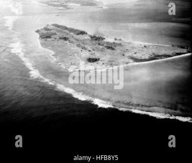 An aerial photograph of Midway Atoll in 1953 shows the layout of the ...