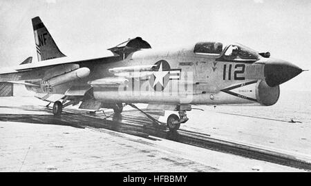 A Vought Crusader jet fighter is launched from an aircraft carrier. The ...