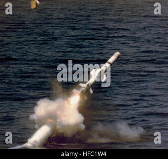 An RGM-84 Harpoon missile is launched from an ASROC launcher aboard ...