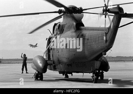 A US Navy (USN) Sikorsky SH-3 Sea King Helicopter is prepared for a ...