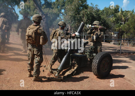 U.S. Marines fire an M327 120mm towed mortar system during a ...