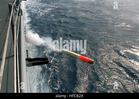A Mark 46 torpedo is launched from the destroyer USS STUMP (DD-978 ...