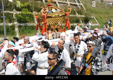 Shinto priests carry then mikoshi ( portable shrine ) at Honensai ...