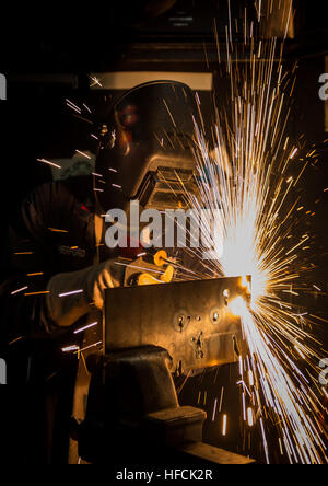 Damage Controlman 2nd Class Shane Rutherford practices using a portable ...