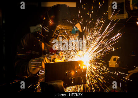 Damage Controlman 2nd Class Shane Rutherford practices using a portable ...