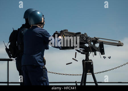 Gunner's Mate's fire a .50-caliber machine gun aboard an aircraft ...