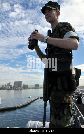 A petty officer standing watch on the quarterdeck of the guided missile ...