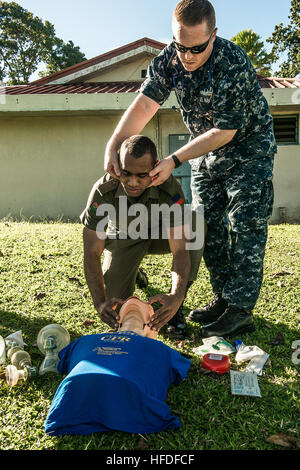 A Hospital Corpsman aboard USNS Mercy performs phlebotomy in the ...