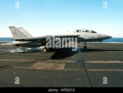 The pilot and Radar Intercept Officer (RIO) of a Fighter Squadron 41 (VF-41) F-14A Tomcat ...