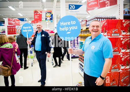 HERE TO HELP YOU: Staff emplyed to help people shopping in the Tesco ...