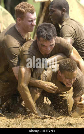 US Navy Fourth Class Midshipmen lock arms and use ropes made from ...