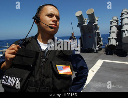 US Navy Torpedoman's Mate John N. Hansen prepares to fire a shot line ...