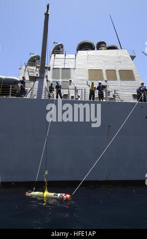 US Navy Sailors hoist an Anti-Submarine Warfare (ASW) MK-50 Torpedo up ...