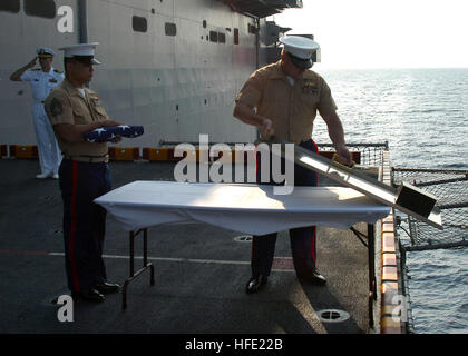 US Navy Gunnery Sgt. commits the earthly remains of Private 1st Class ...