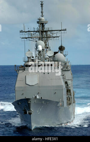 USS Vincennes (CG 49) and USS Kitty Hawk (CV 63) steam side-by-side ...